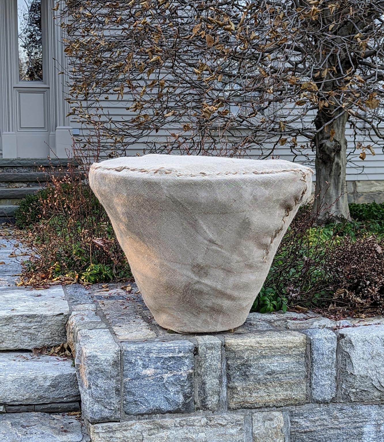 Covering the Many Ornamental Urns with Burlap for Winter - The Martha ...